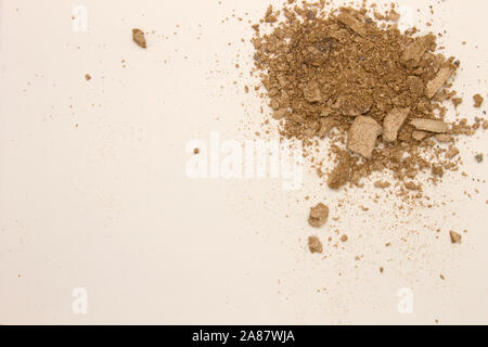 This is a photograph of pale Taupe powder Eye shadow isolated on a ...