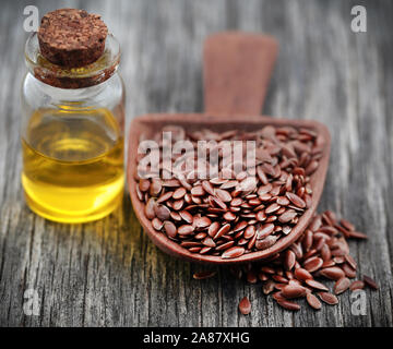 Brown linseed on a bowl over wooden table Stock Photo - Alamy