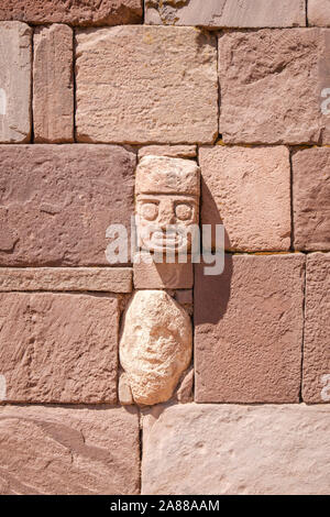 Carved stone tenon heads on the walls of the Semi-underground Temple in ...