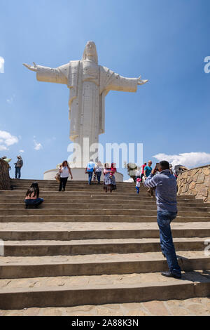 Local people taking photographs at Cristo de la Concordia (or Christ ...