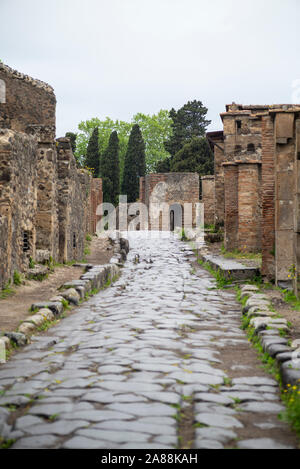 Ancient roman road in the archeological site of Cuma, Campania, Italy ...