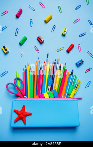 Red pencil case with school stationery on yellow background Stock Photo ...