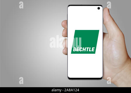 Logo of public company Bechtle AG displayed on a smartphone. Flag of ...