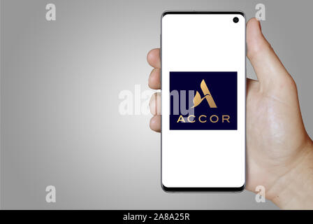 Logo of public company Accor displayed on a smartphone. Negative stock ...