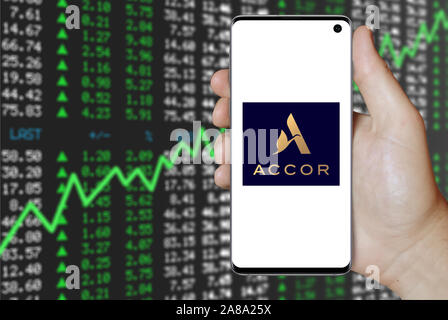 Logo of public company Accor displayed on a smartphone. Grey background ...