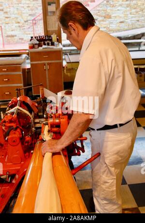 Making chewy salt water taffy candy at Ole Smoky Candy Kitchen, using ...