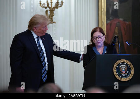 Susan Rescorla, the widow of Richard Rescorla, accepts the Presidential ...