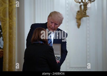 Susan Rescorla, the widow of Richard Rescorla, accepts the Presidential ...
