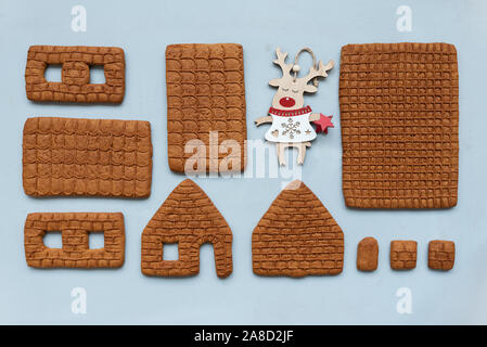 Parts of gingerbread house on wooden table Stock Photo - Alamy