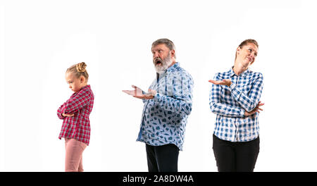 Family members arguing with one another on white studio background ...