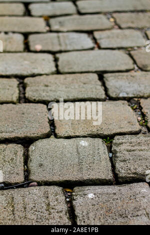 Old square shape cobblestones bricks street surface Stock Photo - Alamy