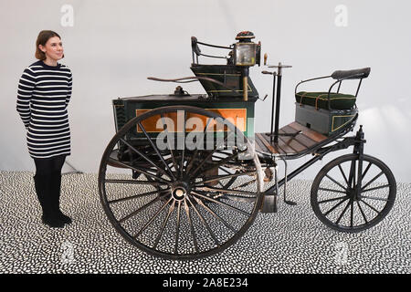 Assistant Curator Esme Hawes looks at the engine of a 1953 Firebird 1 ...