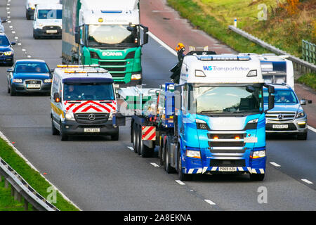 Abnormal load wide load escort vehicle warning on coming traffic with ...