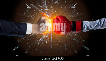Two hands fighting and breaking a glass into small pieces Stock Photo ...