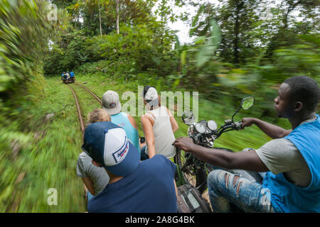 Riding a motorcycle brujita on disused railway tracks to the village of ...