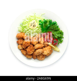 A top view of karaage (Japanese fried chicken) decorated with lemons ...