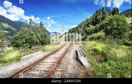 Train rails in Mountain landscape Stock Photo - Alamy