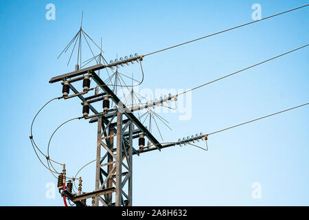wiring and connection elements in an electricity turret on blue sky ...