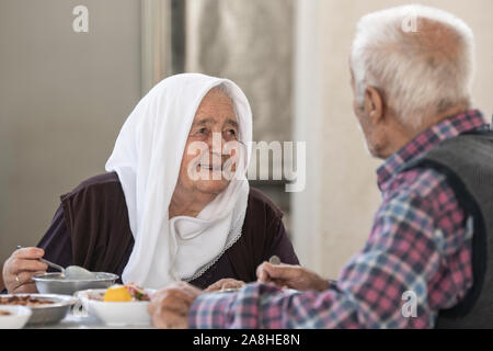 A beautiful, elderly lady living a semi nomadic lifestyle in a village ...