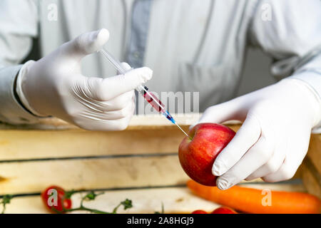 Fruits and vegetables inside an injection needle, nutrition, modified ...