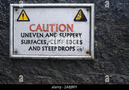 Steep and Uneven Surface Warning sign Stock Photo - Alamy