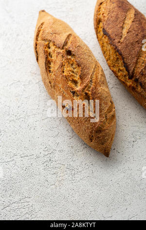 whole wheat two breads and bun on white background Stock Photo - Alamy