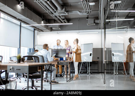 An interior of a modern spacious computer room in a library or office ...