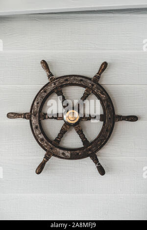 Detail of the wooden steering wheel, or helm, on an historic sailing ...