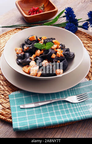 original italian ravioli with squid ink Stock Photo - Alamy