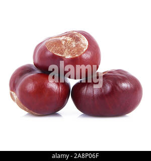 Three chestnuts on white background Stock Photo - Alamy
