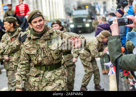 A female first aid soldier in World War 2 uniforms standing next to her ...
