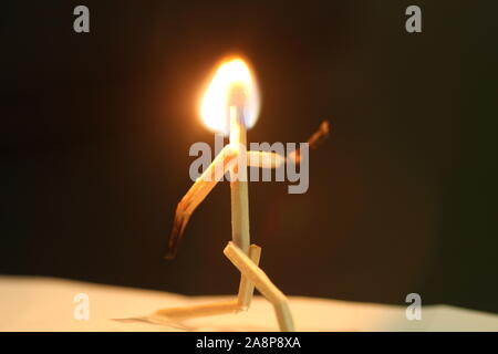 running matchstick man on fire 1 Stock Photo - Alamy