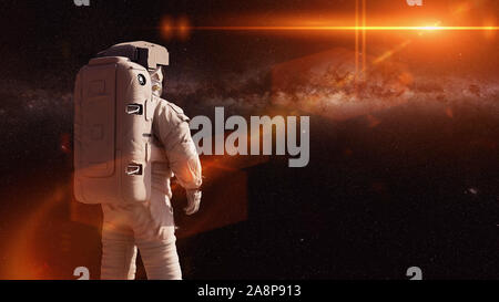 standing astronaut looking into empty space Stock Photo - Alamy
