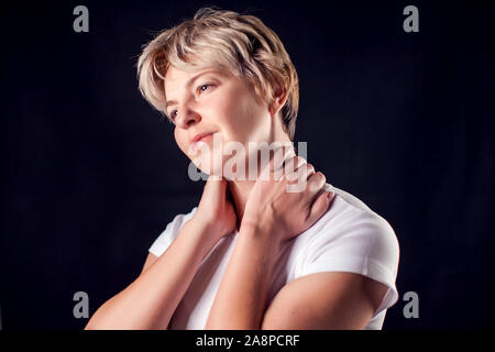 Woman feels strong neck pain. People, healthcare and medicine concept ...