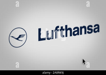 A close up of the Lufthansa logo on the tail fin of a passenger ...
