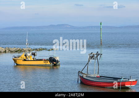 Small boats in Morecambe Bay at low tide Stock Photo - Alamy