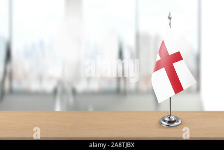 English flag is standing on a metal pole is at office table while ...