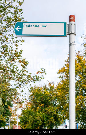 Bicycle paths guide. White sign with city names, The Netherlands Stock ...