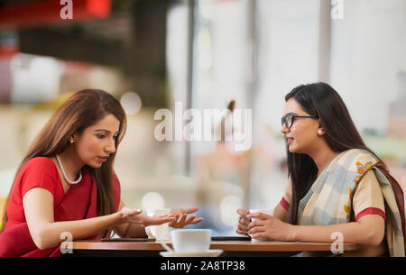 two colleagues having tea Stock Photo - Alamy