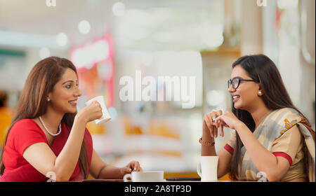 two colleagues having tea Stock Photo - Alamy