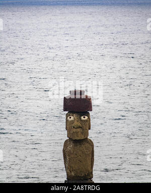 Single Moai statue in front of blue sky easter island Stock Photo - Alamy