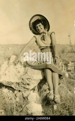 Smiling woman with large brim hat, Italy 1943 Stock Photo - Alamy