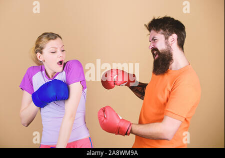 Woman knockout man in boxing pose. Woman looking on floor laying male ...