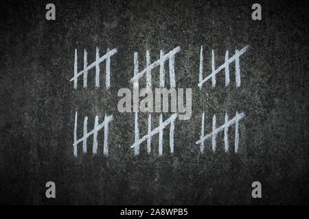 counting days in prison - handwritten lines of white chalk Stock Photo ...