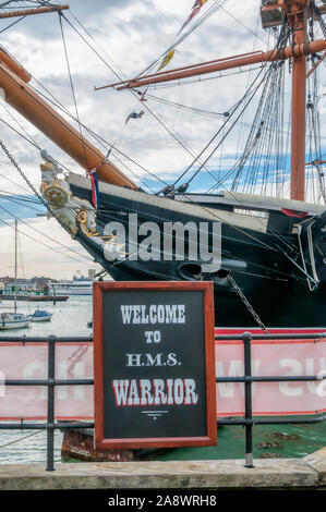 Portsmouth Dockyard sign with and boats Stock Photo - Alamy