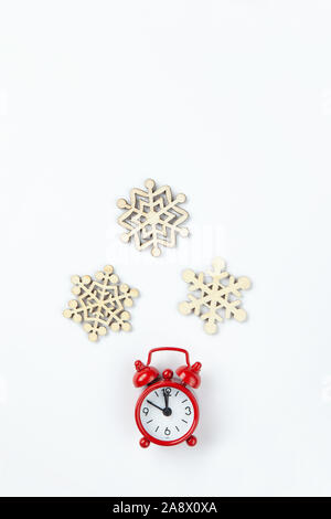 Small Christmas tree, alarm clock, books, presents and glowing lights ...