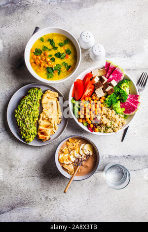 Glass bowl of raw chickpeas on wooden surface. Healthy and nutritious ...