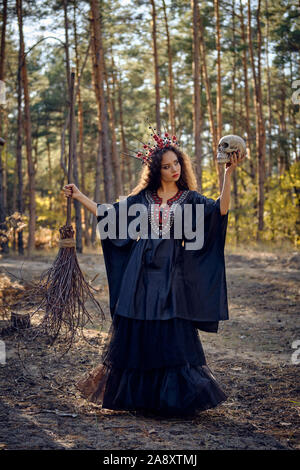 Beautiful, wicked, long-haired charmer in a black, long embroidered ...