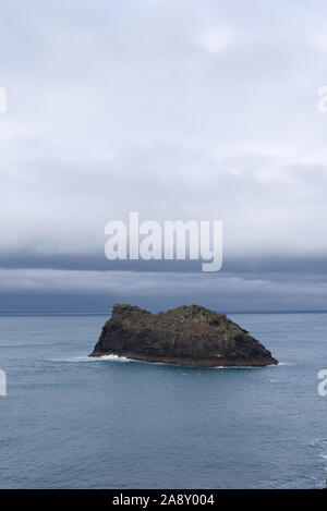 storm clouds rolling in off the ocean as the rising sun creates colors ...