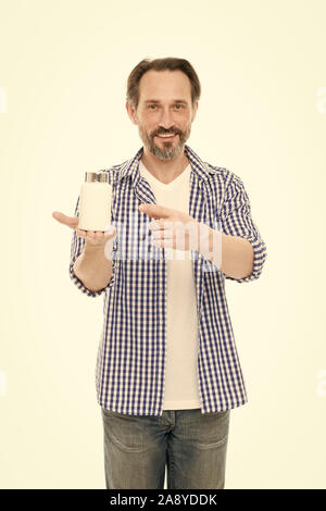 A man taking Vitamin B Complex tablets out of a bottle. Close up Stock ...